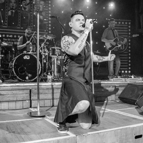 Daniel Budd as Robbie | The Big Tribute